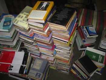 Disorganized_books_piling_one_another – Black Gate